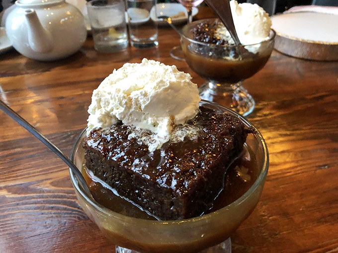 Sticky toffee pudding with a crown of vanilla ice cream. This dessert doesn't just satisfy your sweet tooth—it writes it love sonnets.