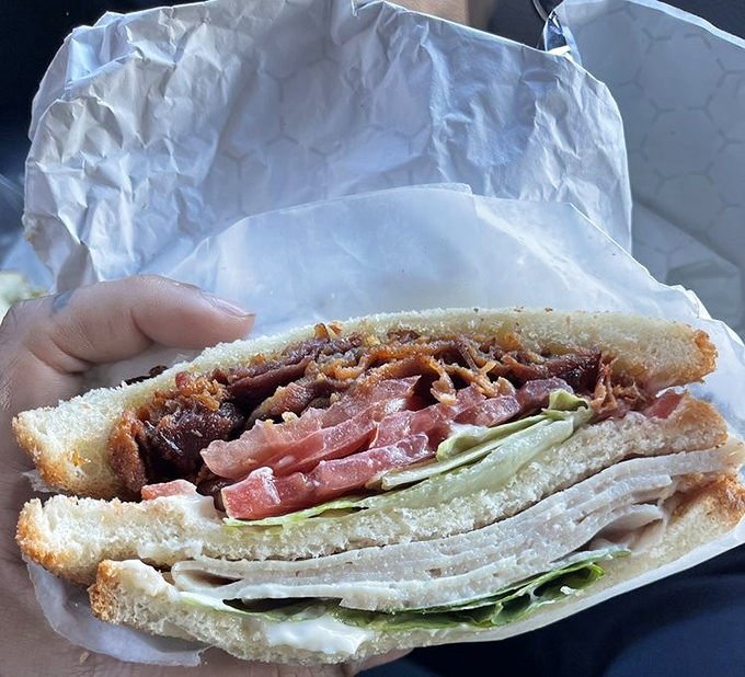 Behold the cross-section of sandwich perfection&mdash;layers of turkey, bacon, and crisp lettuce that would make any brown-bag lunch weep with inadequacy.