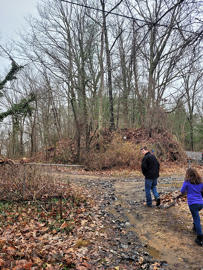 Intrepid explorers venture down muddy paths near the bridge. The things we do for a good ghost story and social media content.