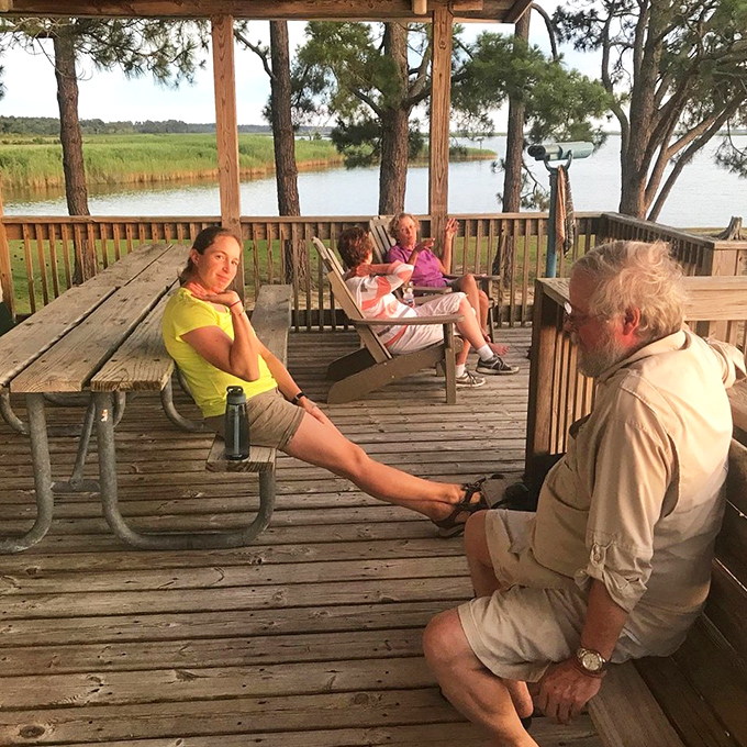 The deck where strangers become friends, united by the shared appreciation of a view that no smartphone camera can truly capture.