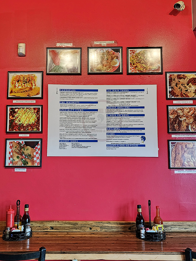 The vibrant red wall gallery serves as both menu and achievement board. Food photography that triggers immediate cravings.