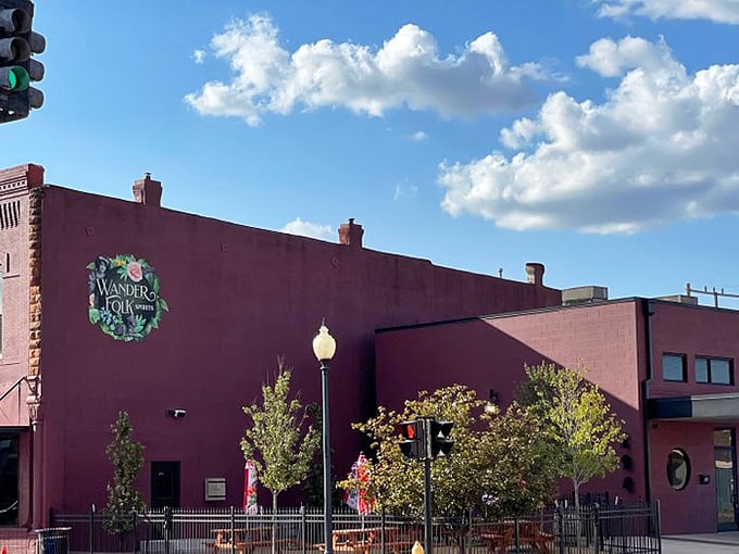 Wanderfolk Spirits' bold burgundy exterior hints at the adventurous flavors waiting inside. When buildings make promises, this one delivers.