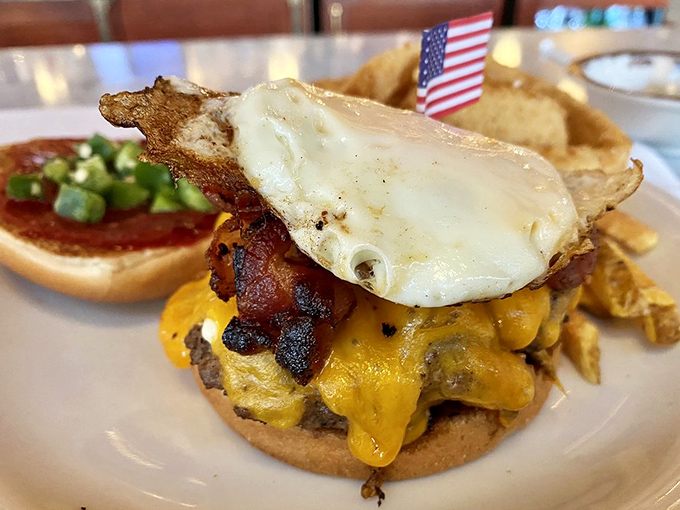 The burger that answers the eternal question: "Can you improve perfection?" Turns out, yes—just add bacon, cheese, and a sunny-side-up egg for breakfast-meets-lunch nirvana.