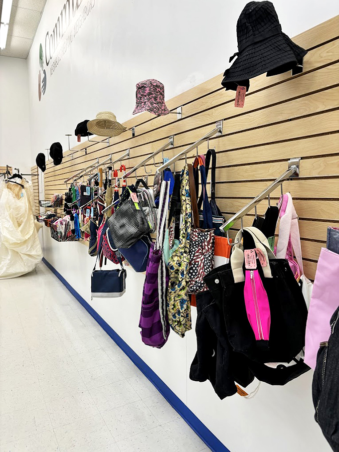 Handbag heaven hanging in perfect formation. That black tote with the pink zipper is practically screaming, "Take me home and fill me with important things!" 