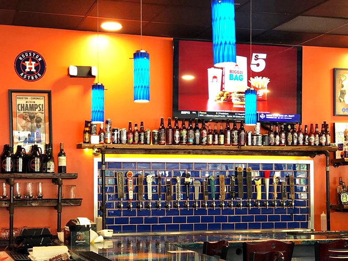 Beer taps that promise liquid happiness. The blue tile backsplash adds a pop of color that says, "Yes, we take our brews seriously."