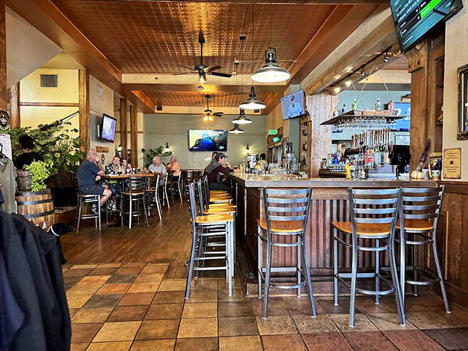 The bar isn't just where drinks are served&mdash;it's where stories are exchanged. Wood, warmth, and the promise of craft beer create the perfect mountain town gathering spot.