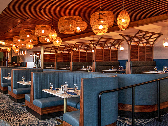 These blue booths aren't just comfortable seating&mdash;they're little sanctuaries where good conversations and better meals happen simultaneously.