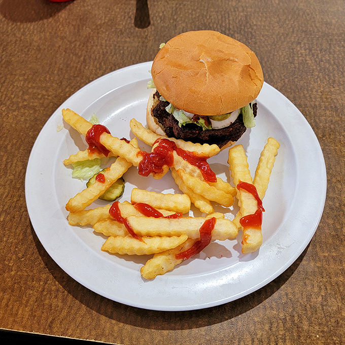 The classic American burger-fries duo, executed with the precision of an Olympic synchronized swimming routine. Simple perfection.
