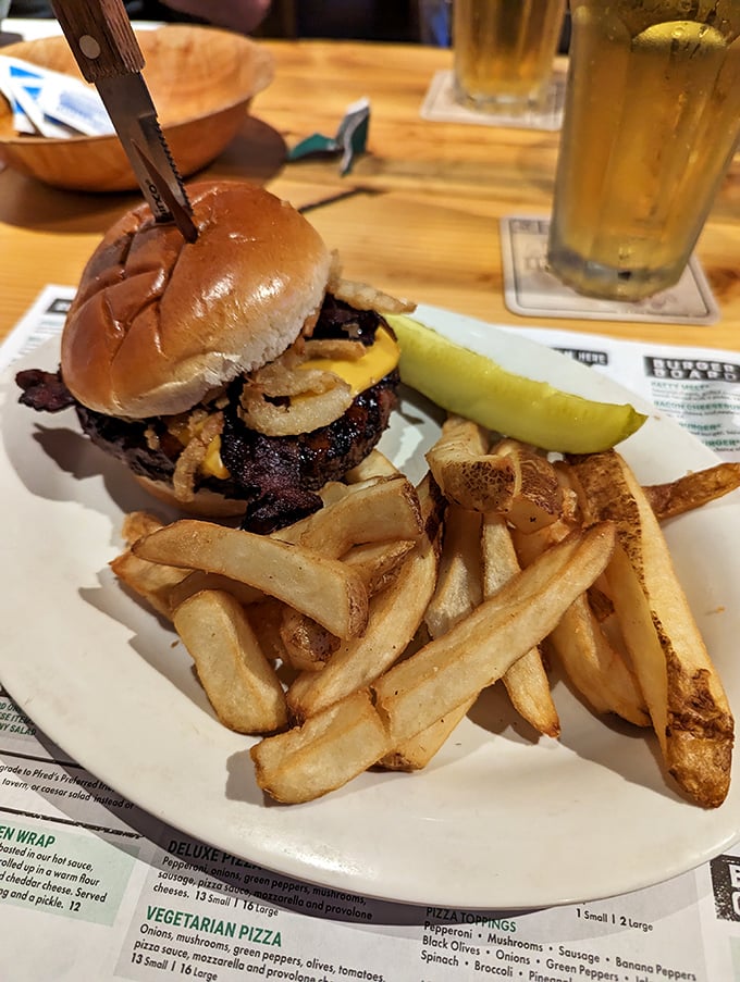 This isn't just a burger&mdash;it's architecture with cheese. The pickle stands guard like it knows something special is happening.