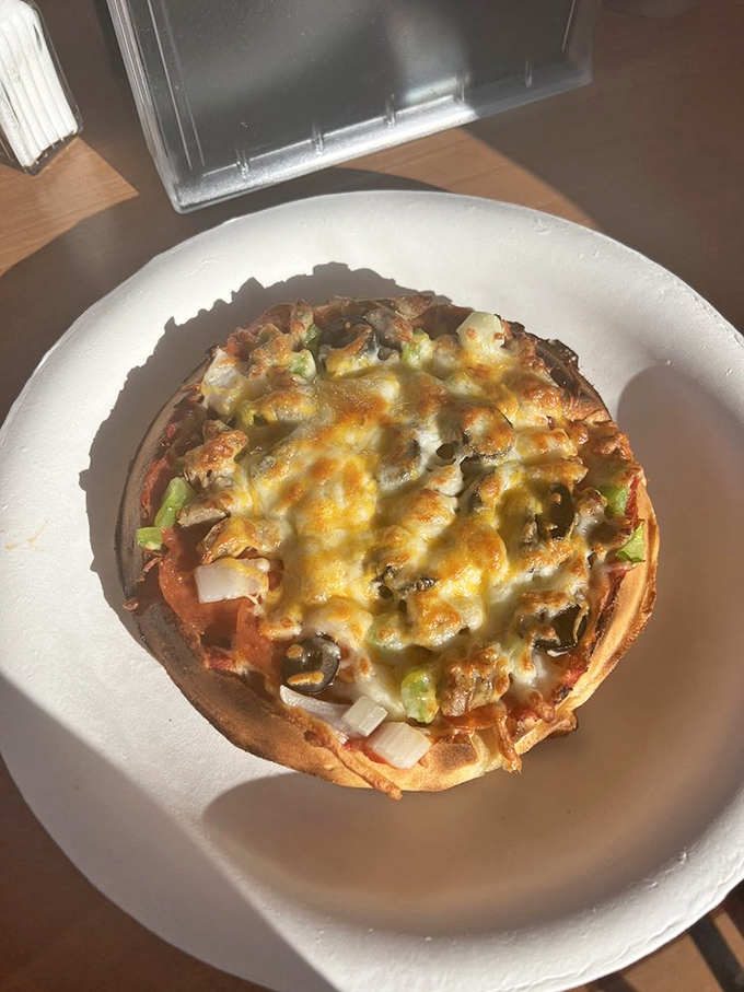 The waffle pizza experiment that actually worked: melted cheese, veggies, and sauce on a waffle base. It's breakfast and lunch having an affair on your plate.