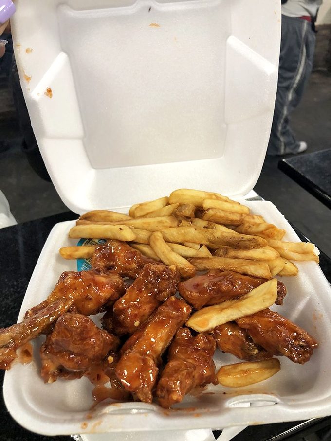 These wings aren't playing around&mdash;glazed with sweet-spicy sauce and paired with fries for the perfect comfort food duet.