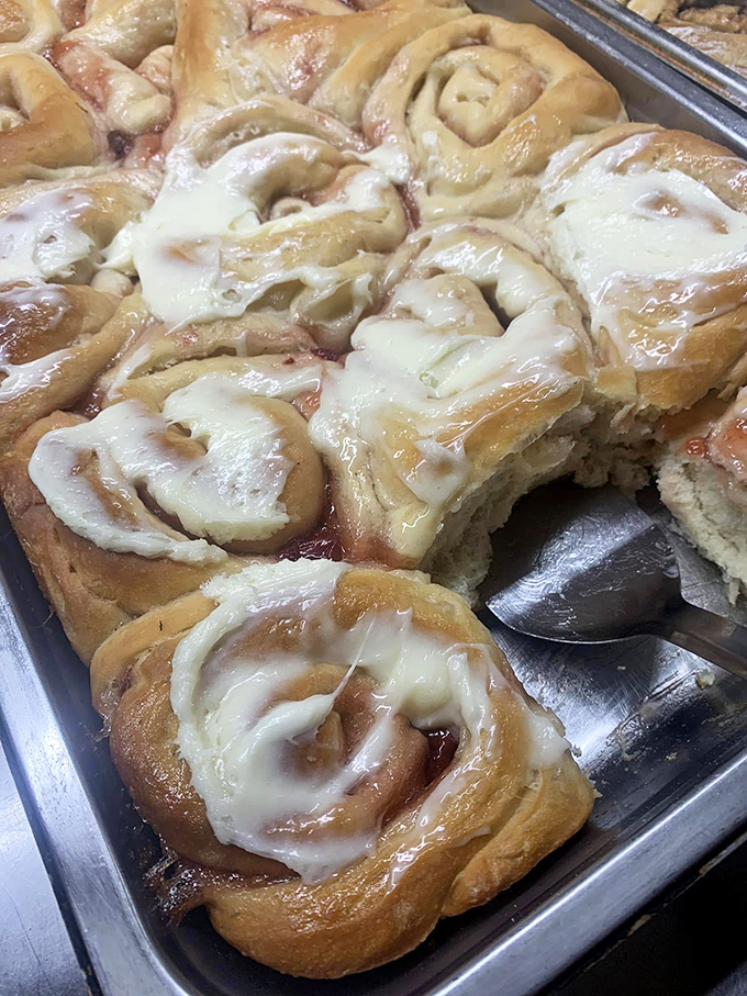 Cinnamon rolls wearing their icing like satin robes&mdash;plump, glistening, and completely unapologetic about their curves.