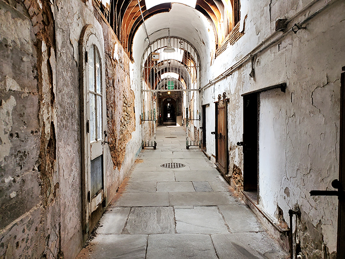The abandoned exercise yard, where weeds now serve longer sentences than any former inmate. Mother Nature: the ultimate reclaimer of human spaces.