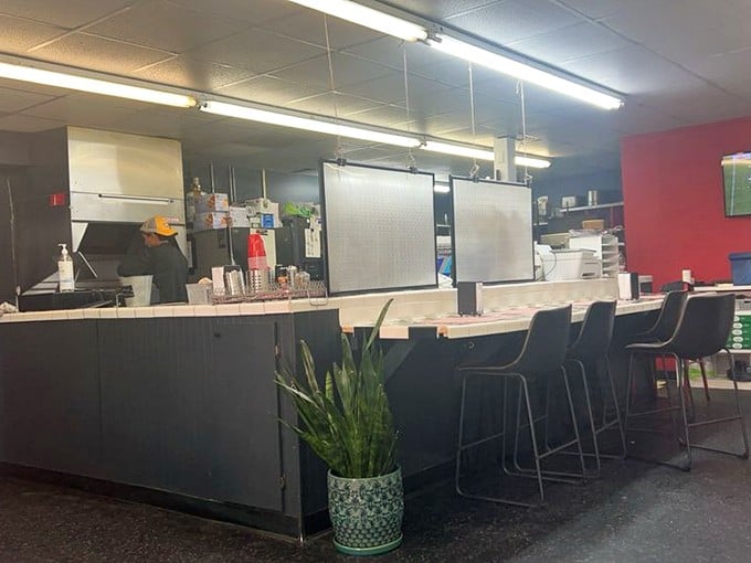 Where sandwich magic happens! The minimalist counter lets the food be the star while potted plants add a touch of homey charm.