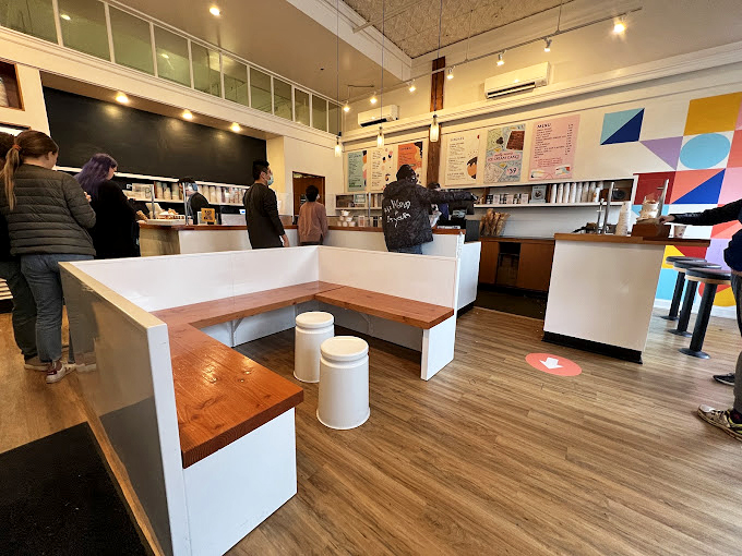 The calm before the flavor storm. Patrons line up with the patience of saints, knowing that paradise awaits just a few minutes away.