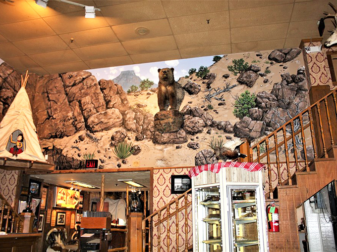 The desert mural featuring a bear watching over diners ensures you're never alone, even when you're tackling that massive steak challenge.