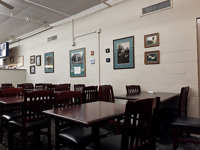 The walls tell stories of Athens history through simple framed photos, creating a community dining room where memories are made between bites.