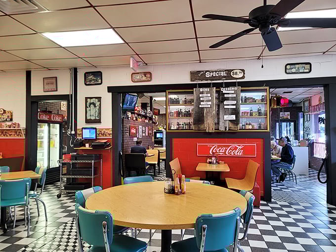 The kitchen pass-through window frames breakfast artistry in action. Red Coca-Cola accents remind you that some brand partnerships are timeless.