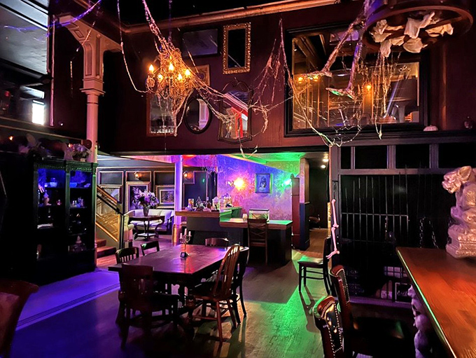 Fake cobwebs, moody lighting, and Victorian furnishings create the perfect atmosphere for sipping something that might just be cursed. 