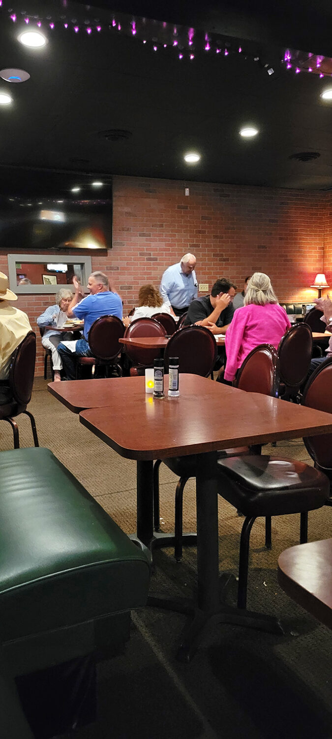 The dining room tableau: strangers connected by nothing more than good food and the universal language of satisfied appetites.