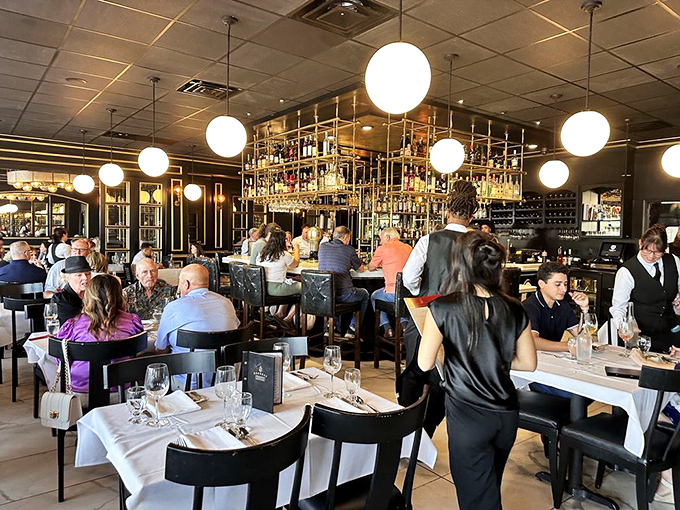 Where Wichita meets Paris: diners enjoying that magical moment when conversation pauses because the food has arrived.