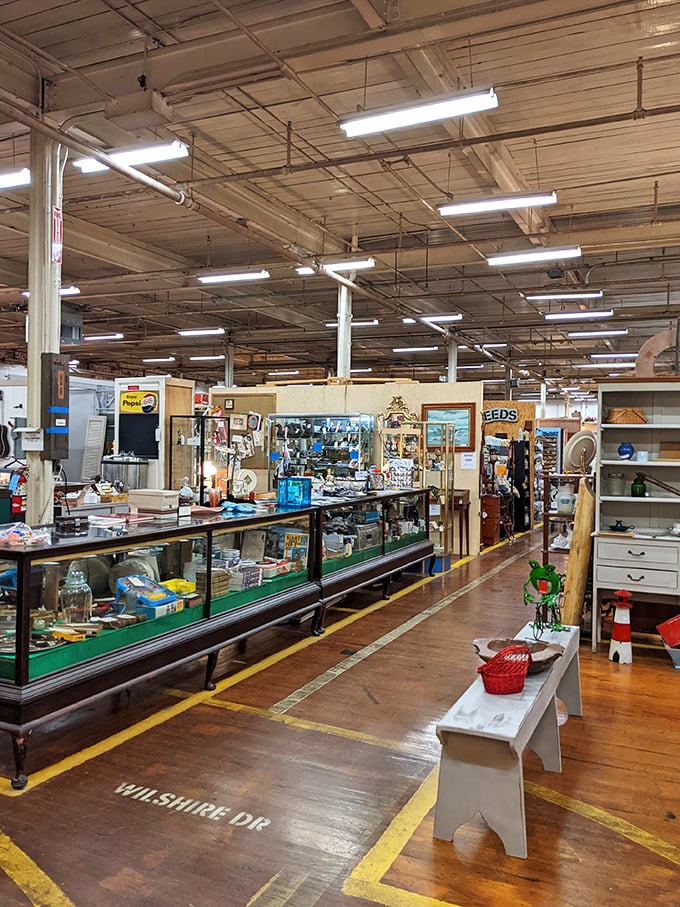 The yellow lines on these original mill floors once guided textile workers; now they lead treasure hunters to display cases filled with collectibles.