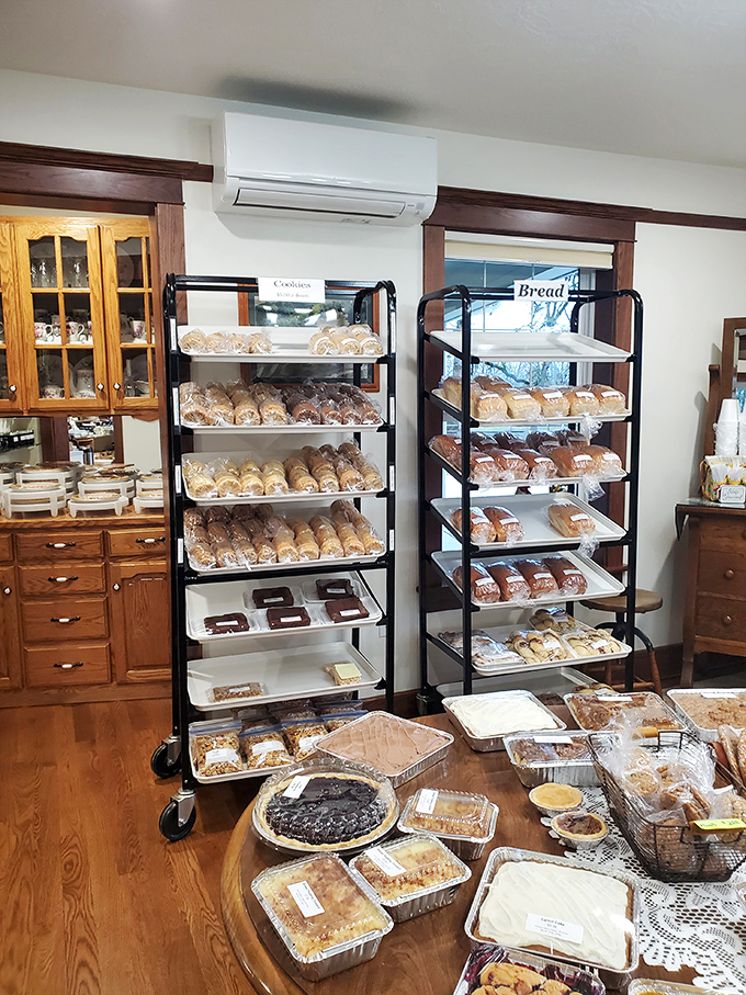 Bread racks standing at attention like delicious soldiers, each loaf and pastry patiently waiting for its forever home. 