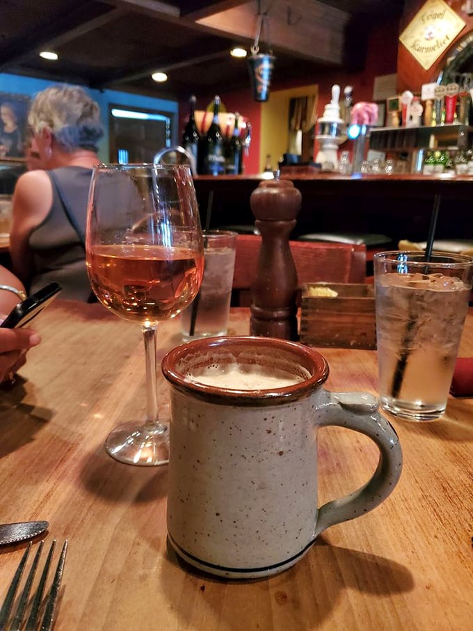 The holy trinity of tavern contentment: good wine, cold water, and a sturdy mug that's seen its share of stories told across wooden tables.
