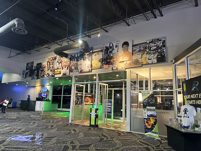 The entrance gallery showcases racing legends, serving as both inspiration and stern reminder that your go-kart performance probably won't earn you wall space.