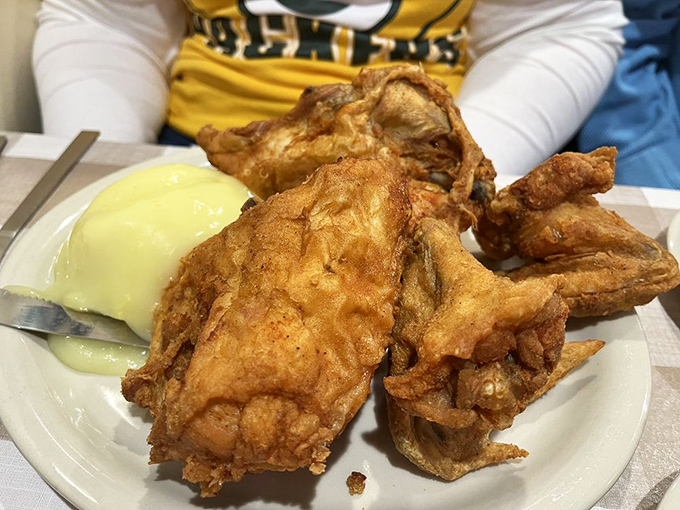 Fried chicken so perfectly golden it deserves its own trophy. Crispy exterior, juicy interior, and a side of mashed potatoes that could make a grown man weep.