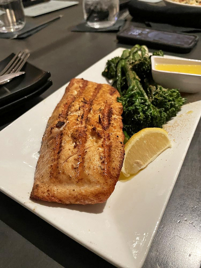 Salmon grilled with such precision it practically sparkles. Paired with vibrant broccolini and lemon&mdash;simplicity that showcases culinary confidence.