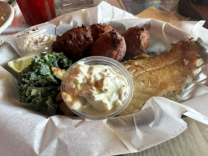 Fish that looks like it jumped from the lagoon to your plate, with hush puppies standing guard to make sure you finish every bite.