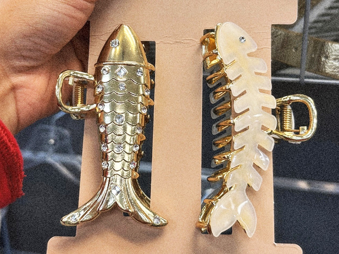 Quirky accessories like these fish-shaped hair clips prove that secondhand shopping often yields the conversation pieces department stores can't match.