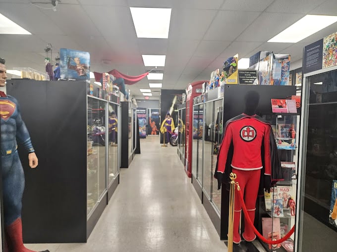The corridor of heroes feels like walking through comic book history, with each display case offering a new chapter in America's colorful mythology of caped crusaders.