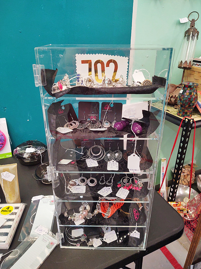 Jewelry displayed like tiny treasures in a clear castle, each piece waiting to start its second life on someone new.