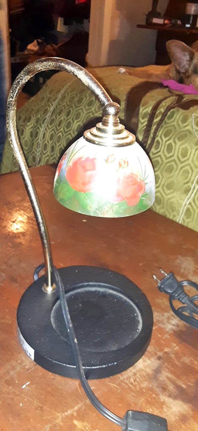 This vintage lamp with hand-painted shade waits to cast its warm glow in someone's reading nook &ndash; retro charm at bargain basement prices.