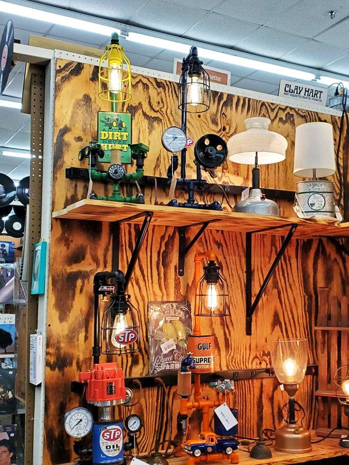 Industrial chic meets nostalgic Americana in this illuminating display where vintage oil lamps and repurposed STP cans become conversation-starting light fixtures.