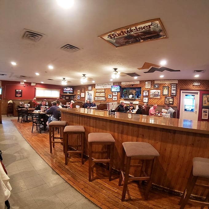 The bar stretches like a runway of possibilities, each stool offering a front-row seat to the craft beer magic happening behind the scenes.