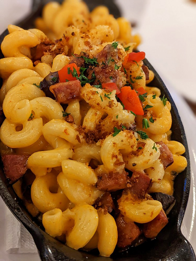 Mac & cheese with grown-up ambitions, featuring smoky meat chunks and fresh herbs. Comfort food that went to college and came back sophisticated.