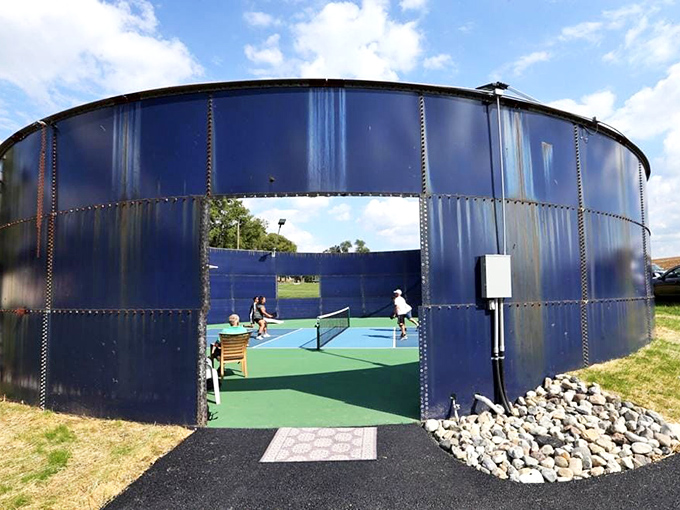 This repurposed tank now serves as a surprisingly delightful tennis court—because country ingenuity turns everyday objects into unexpected pleasures.
