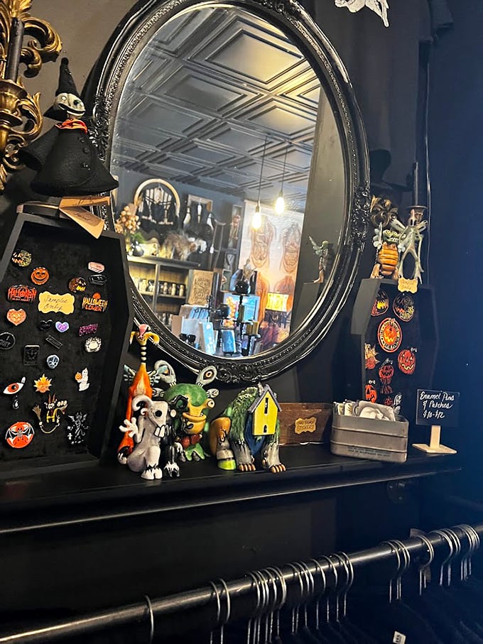 An ornate Victorian mirror reflects not just the shop's treasures but perhaps a glimpse into another era, surrounded by pins and figurines for the less macabre-minded visitor.