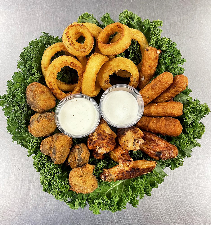 The appetizer sampler that settles all family feuds&mdash;onion rings, mozzarella sticks, and chicken bites creating peace at the table one bite at a time.