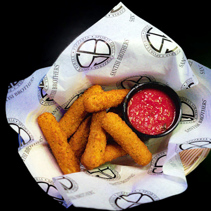 Mozzarella sticks that stretch the definition of perfection – golden-crusted wands of cheese magic with marinara for dipping.