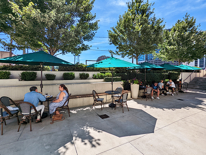 Summer lunches under emerald umbrellas&mdash;where Atlanta's sunshine and Henri's sandwiches create the perfect midday escape from reality.