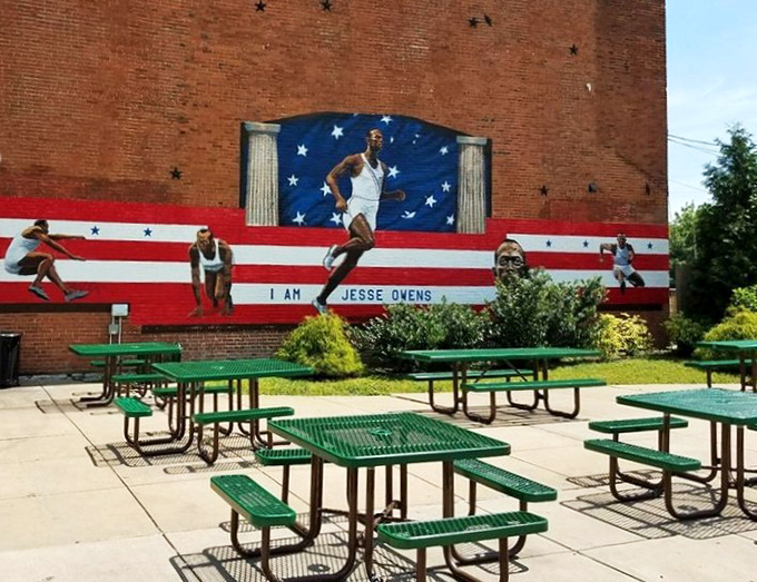 Outside, a Jesse Owens mural watches over picnic tables where sticky fingers and chocolate-stained smiles are badges of honor.