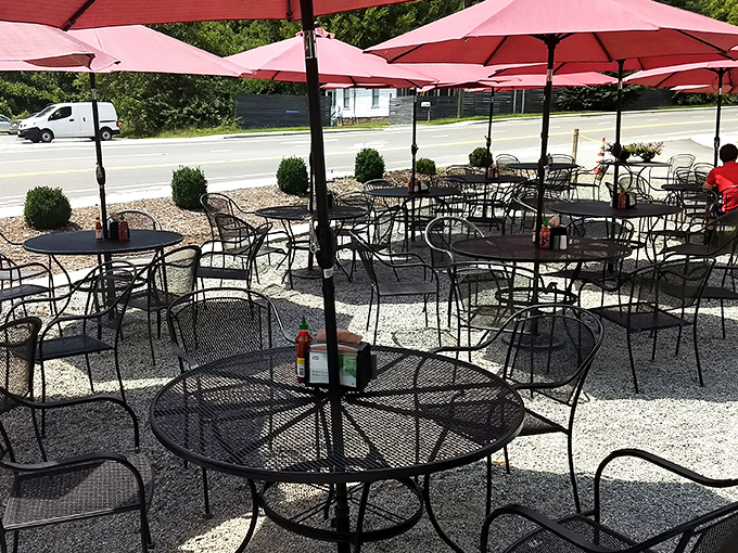 Red umbrellas create islands of shade where customers savor their BLTs al fresco, making every beautiful day in Chapel Hill even better.