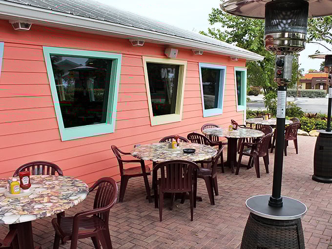 Outdoor dining with a side of Florida charm. Those colorful mosaic tables have witnessed more vacation memories than your camera roll.