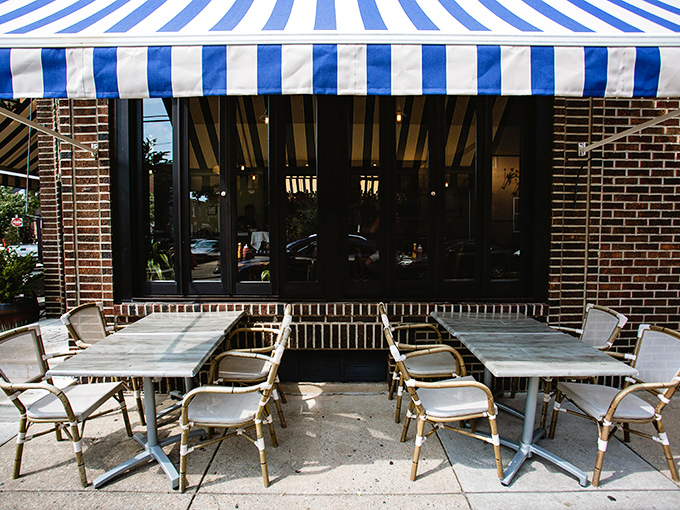 European caf&eacute; vibes on a Philadelphia sidewalk. The blue and white awning creates a little breakfast oasis right on the corner. 