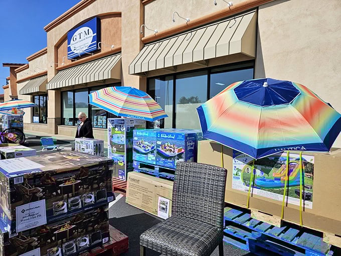 Outdoor living displays spill into the parking lot like an impromptu block party of patio possibilities. Those umbrellas practically radiate affordable summer fun.