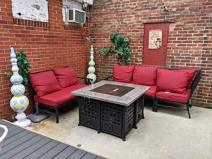 The outdoor patio offers a moment of brick-walled tranquility with whimsical touches&mdash;proof that Wonderland extends beyond the cafe's interior.